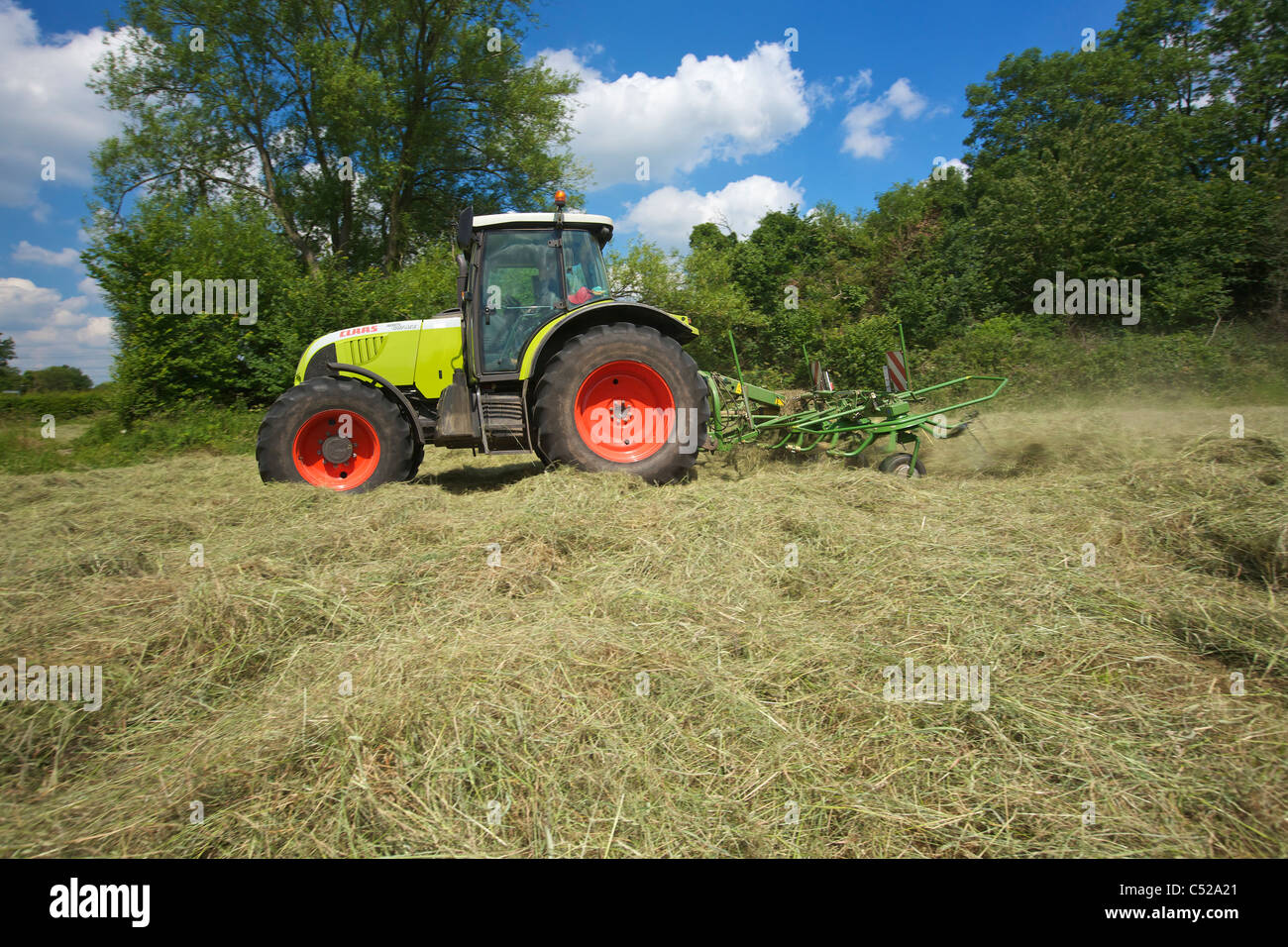 Claas Ares 697 ATZ turning Hay Stock Photo - Alamy