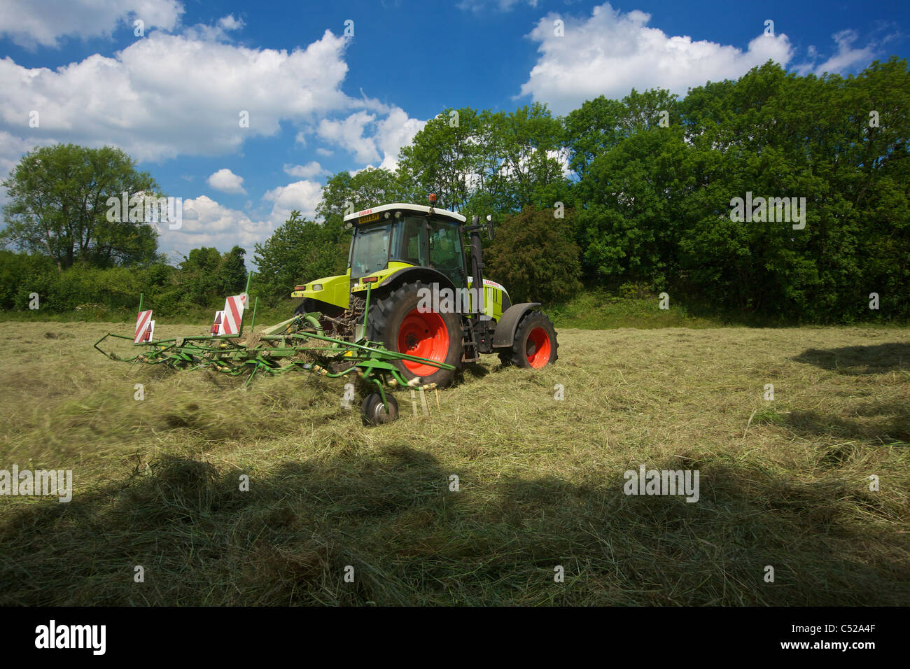 Claas Ares 697 ATZ turning Hay Stock Photo - Alamy