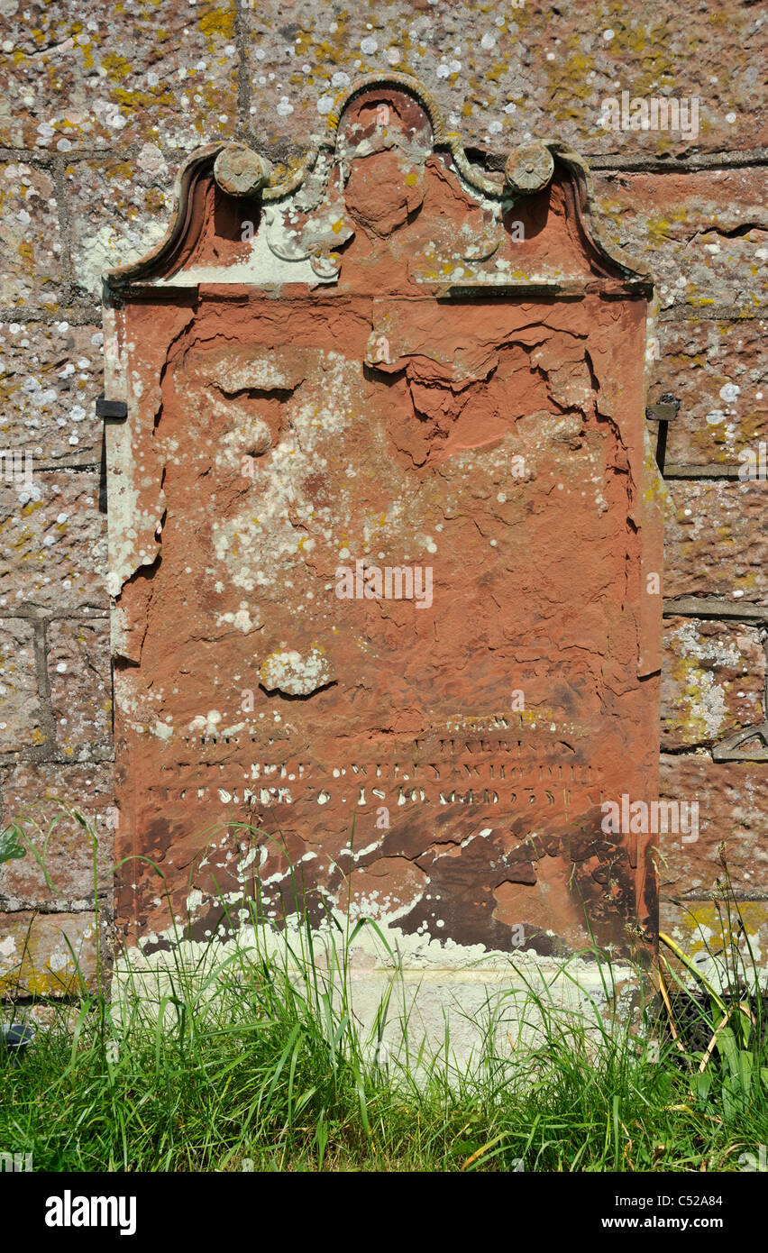 Badly eroded sandstone gravestone, All Saints Church. Culgaith, Cumbria ...