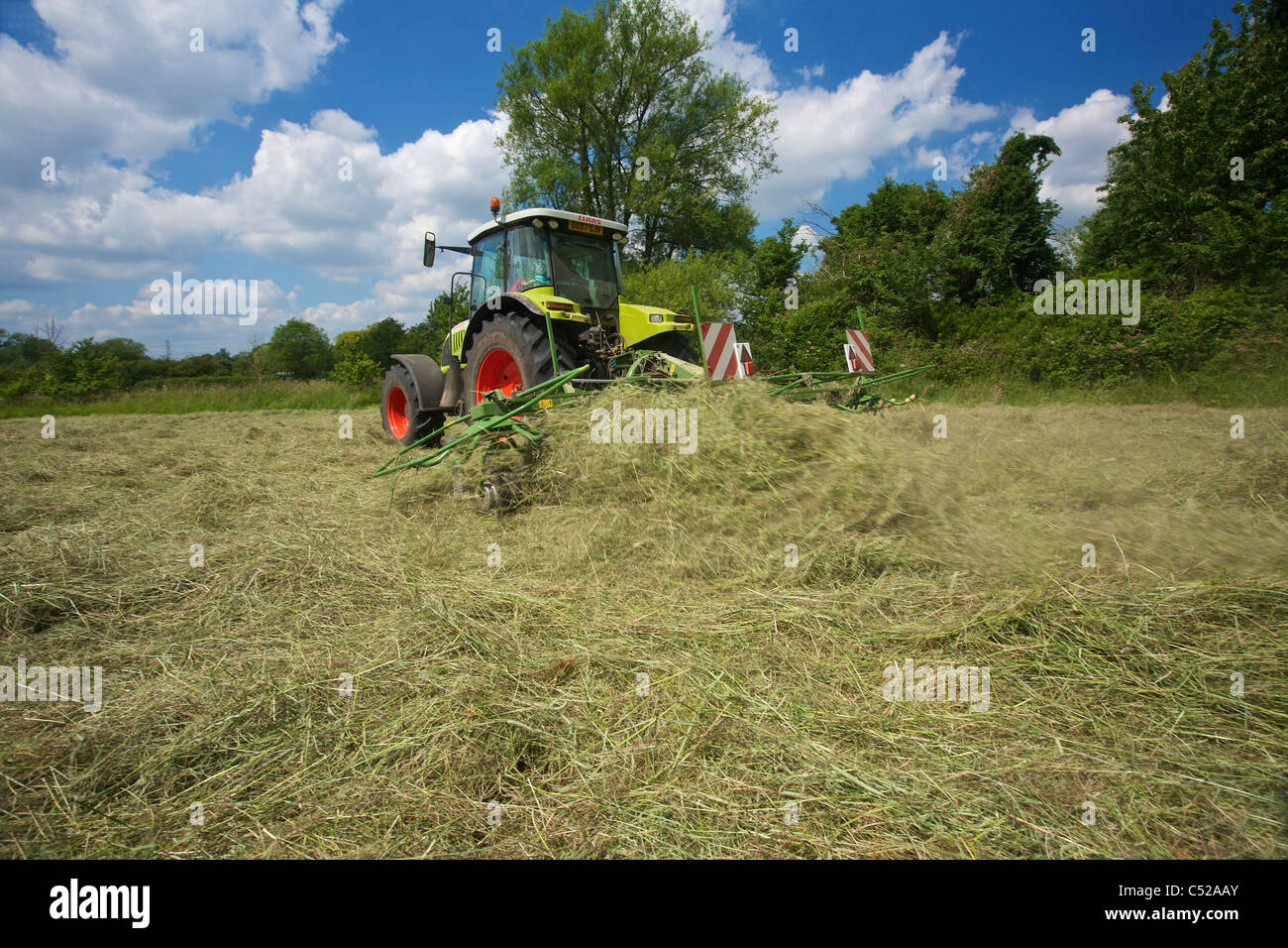 Claas Ares 697 ATZ turning Hay Stock Photo - Alamy