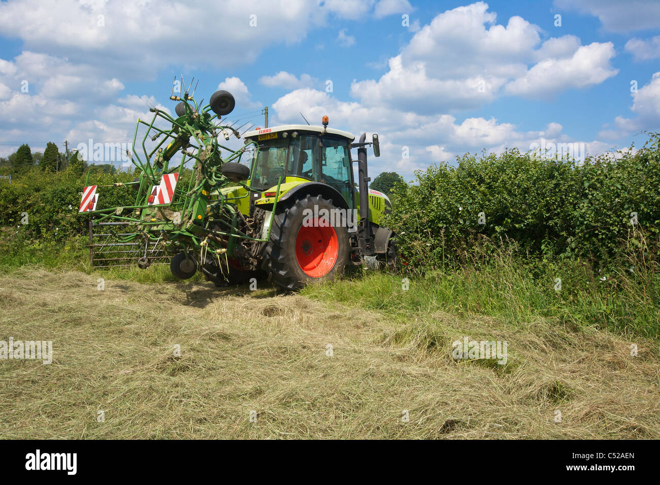 Claas Ares 697 ATZ leaving field after turning Hay Stock Photo - Alamy