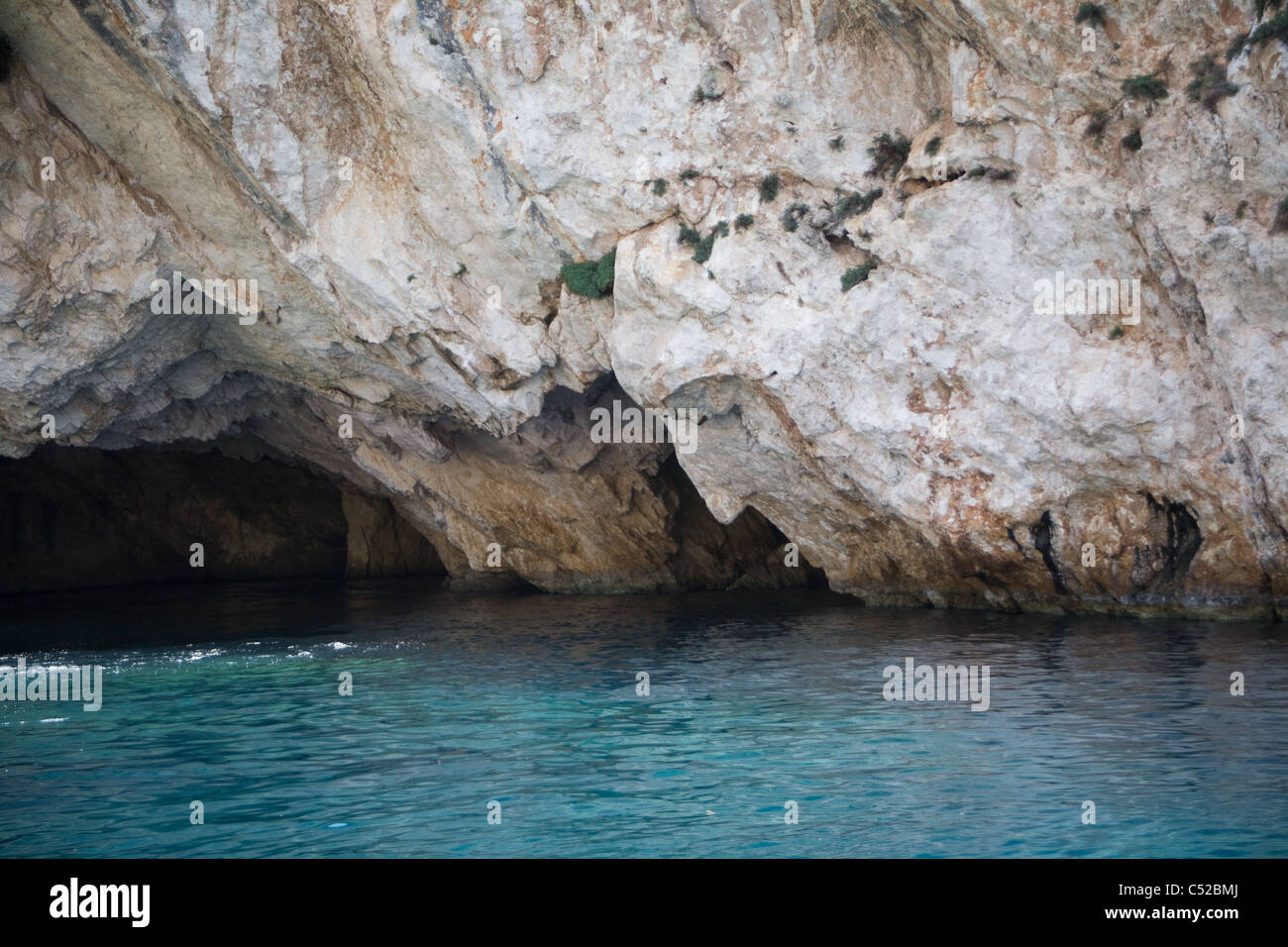 The face of a Greek god Poseidon appears in the rock as if drinking ...