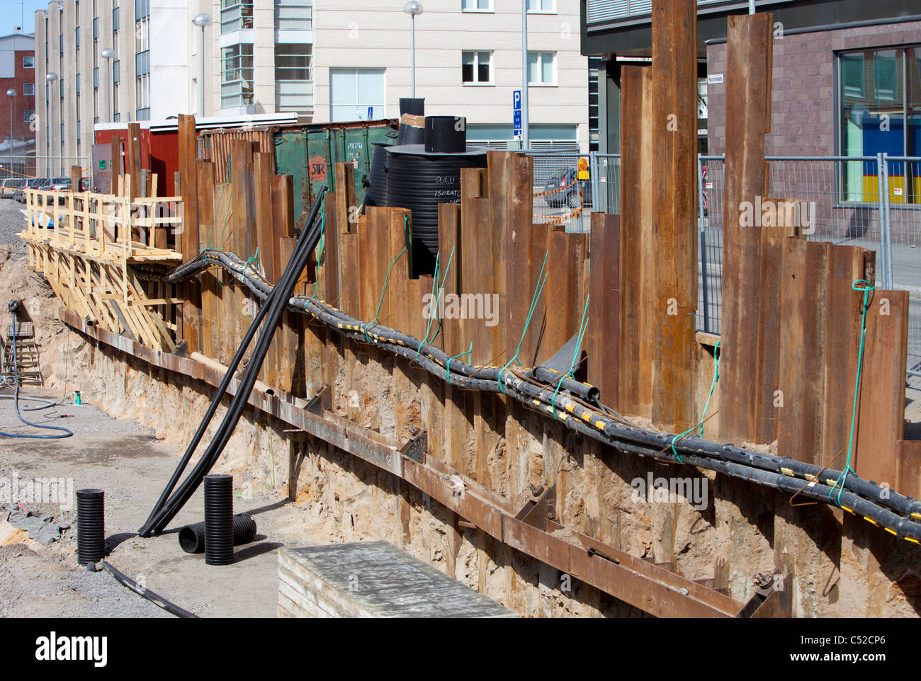 Steel sheet piles ( stilts ) on building foundation and temporarily ...