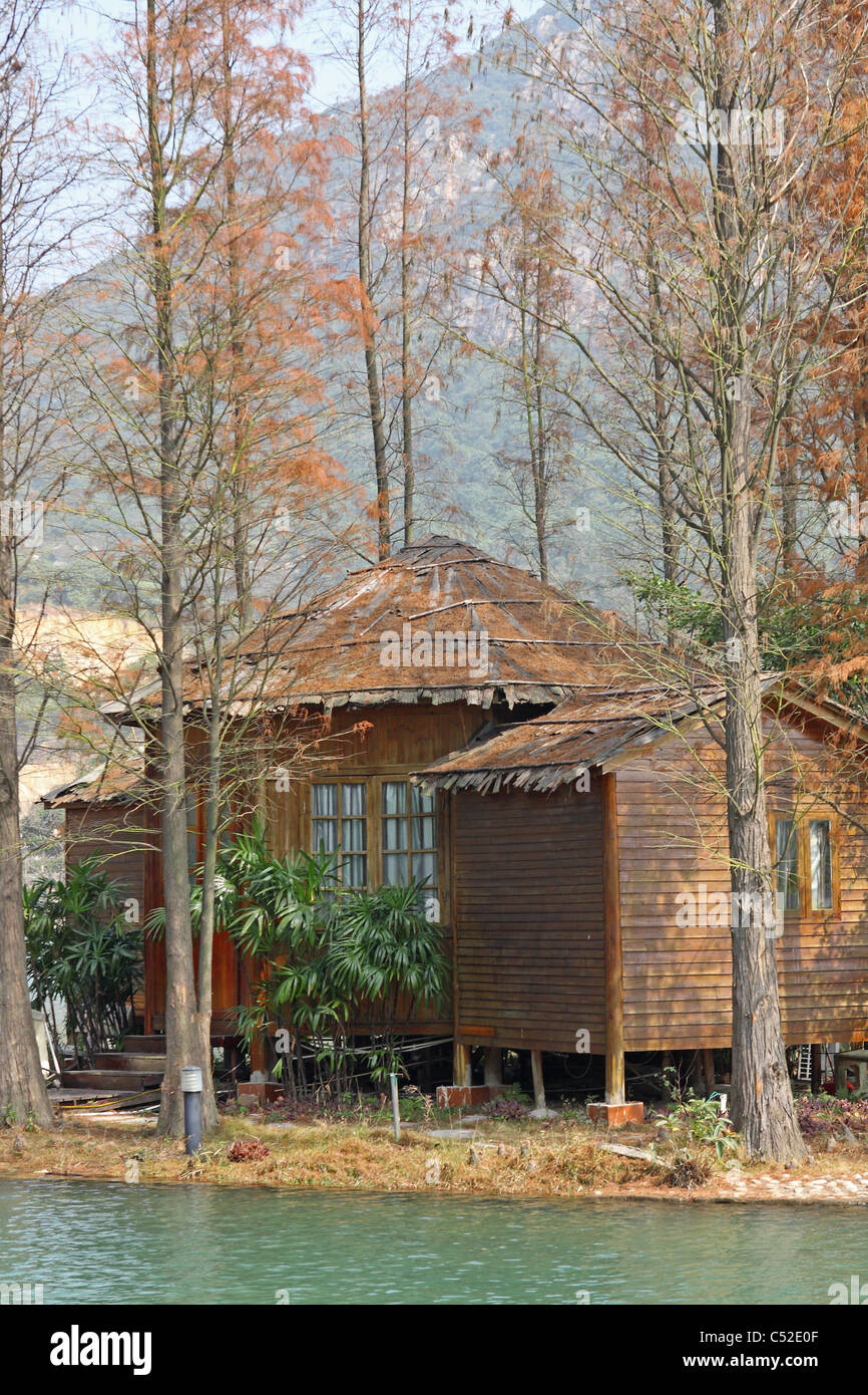 wood house on water and trees Stock Photo - Alamy