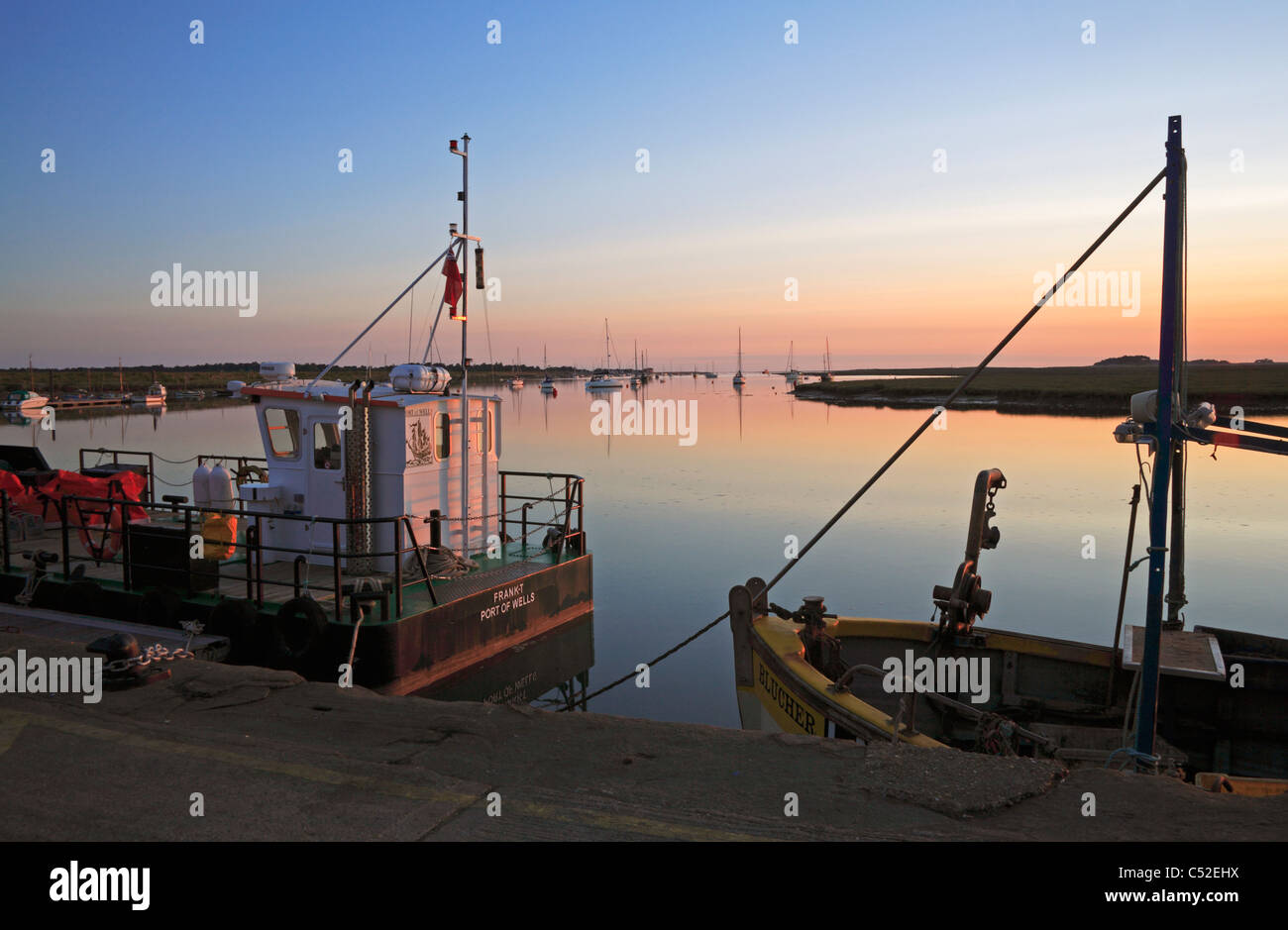 A view of the harbour and channel at first light at Wells next the Sea ...