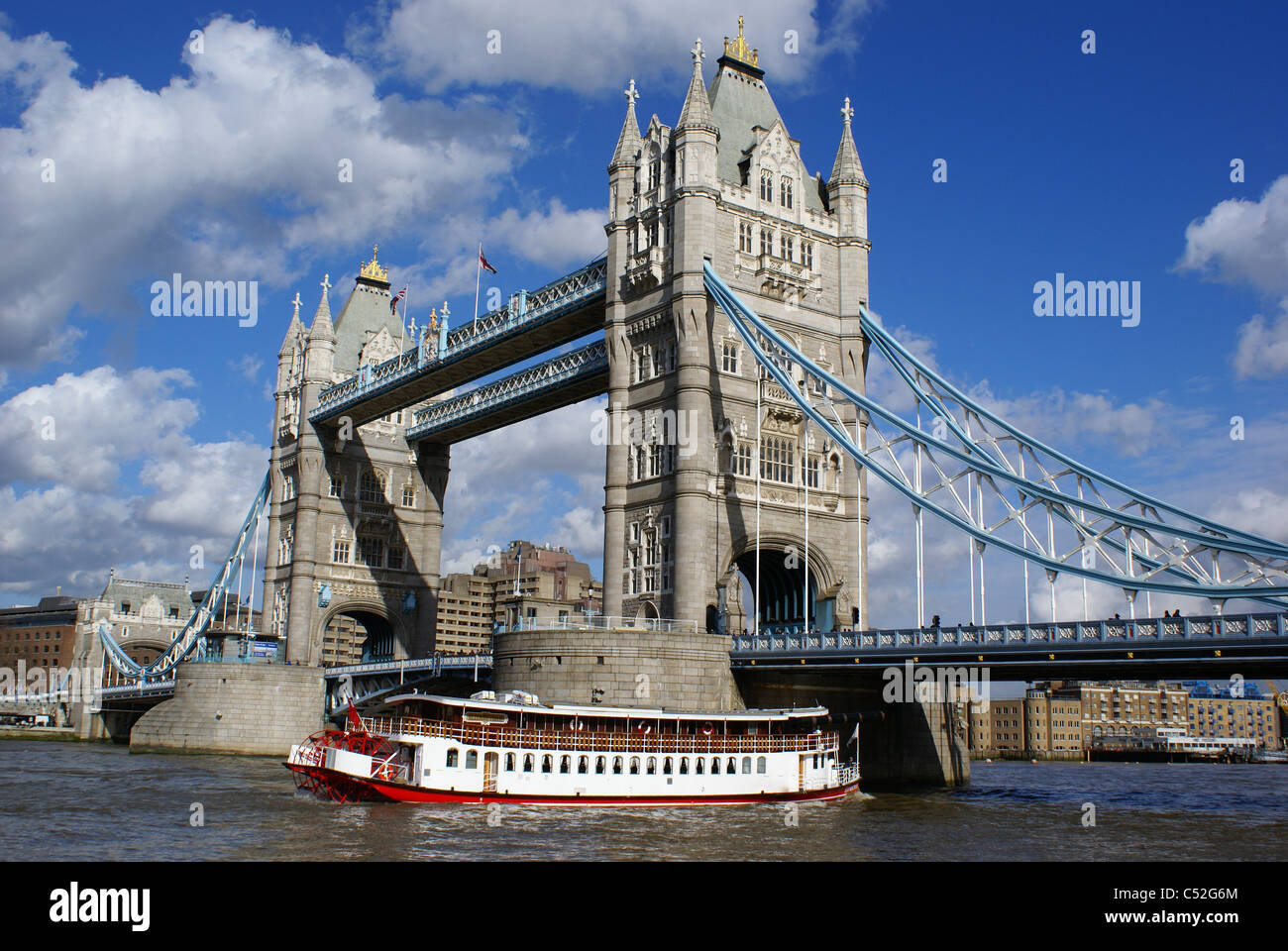 Tower Bridge and a river cruise boat in the Thames, London,UK Stock ...