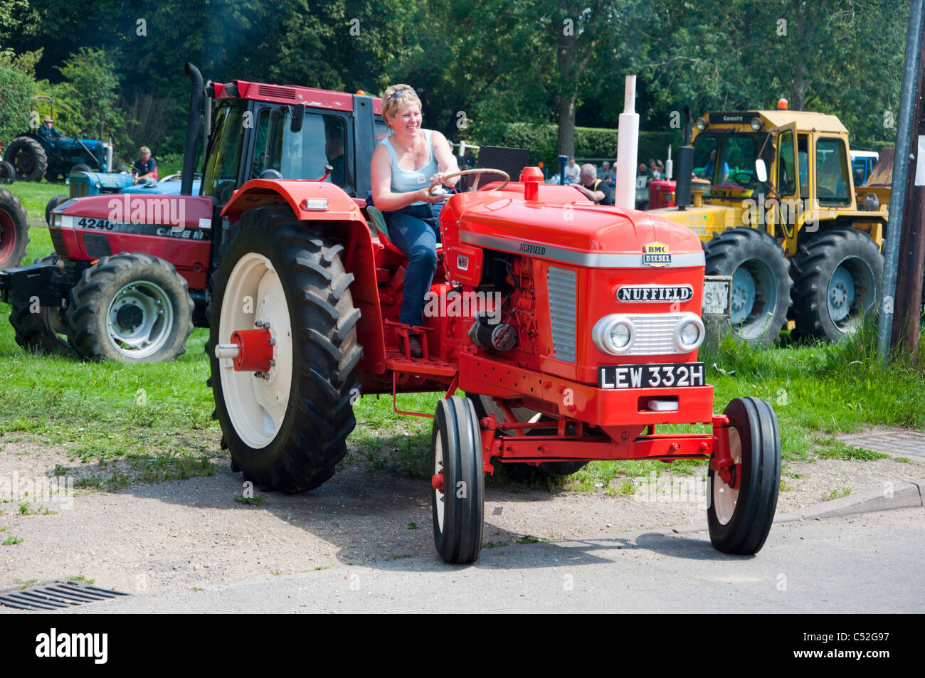 Woman Vintage tractor rally Stock Photo - Alamy