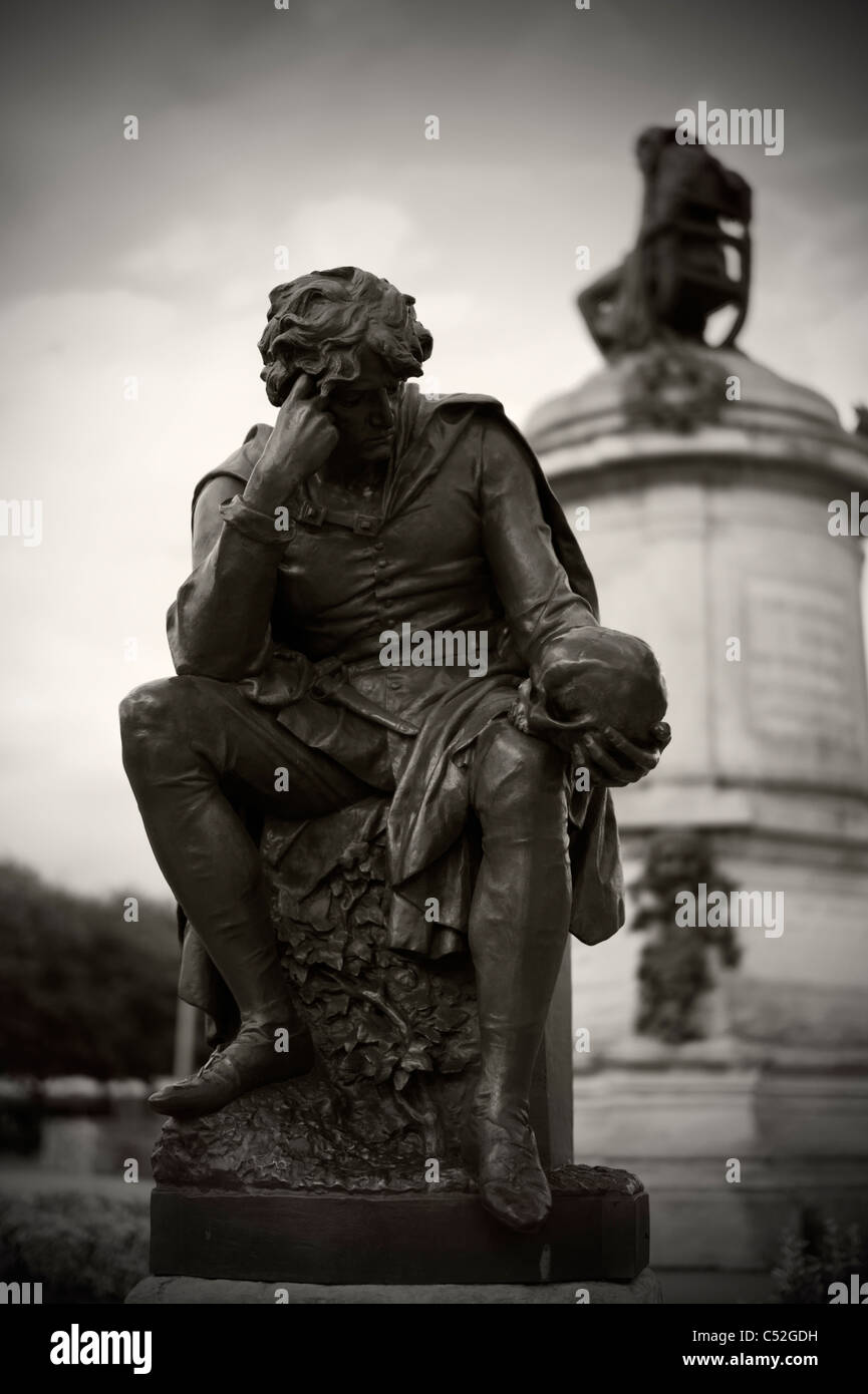 Statue of Hamlet with a statue of William Shakespeare in the background ...