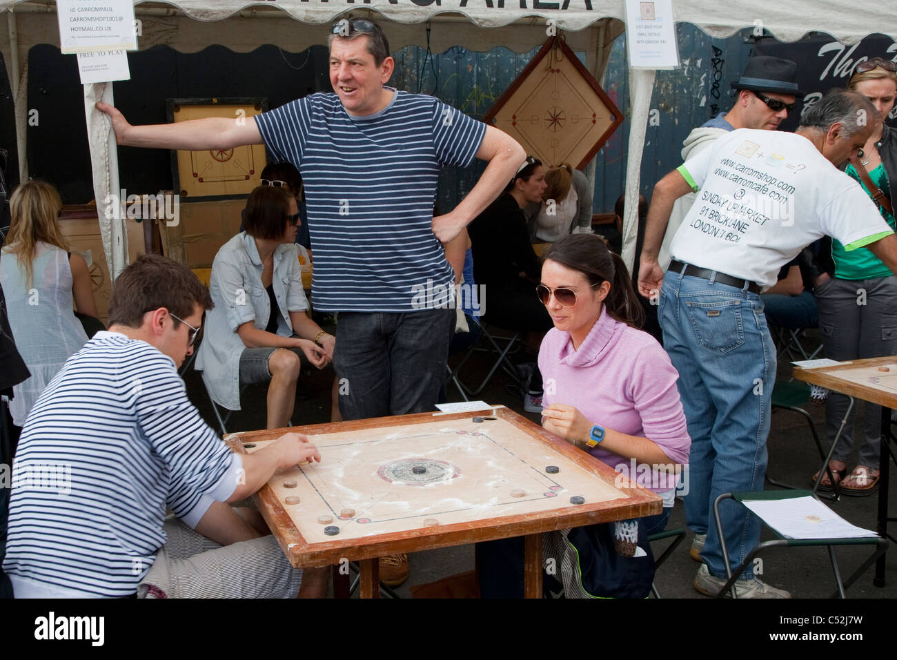 Carrom playing hi-res stock photography and images - Alamy
