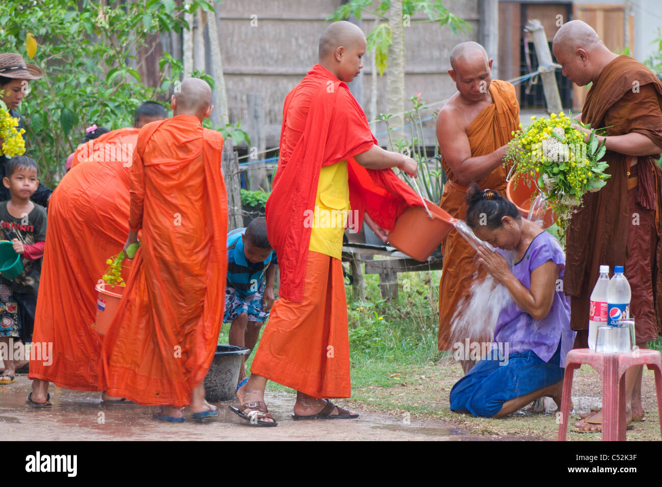 Woman receiving blessing on Songkran Stock Photo - Alamy