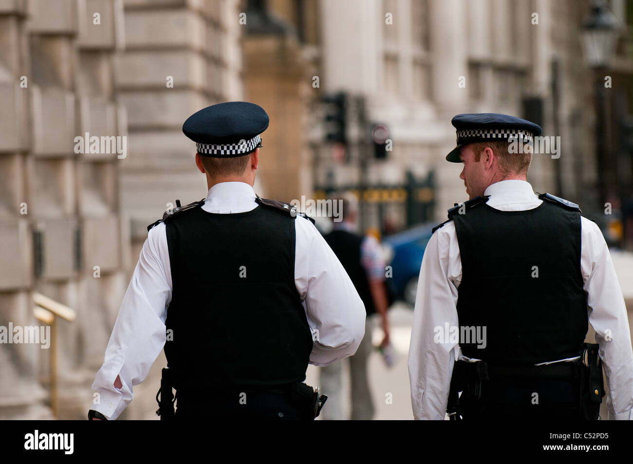 Two London Metropolitan police officers on duty Stock Photo - Alamy