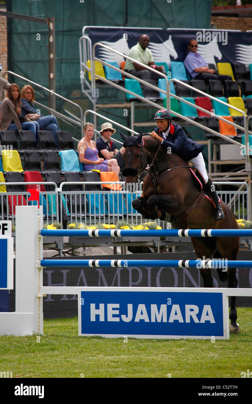 Patrick McEntee from Azerbaijan in action on the horse Dollar Du Mury ...