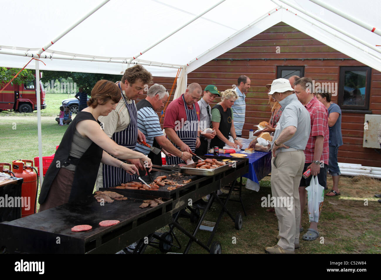 The queue at the barbeque tent at an English country show in Cannington ...