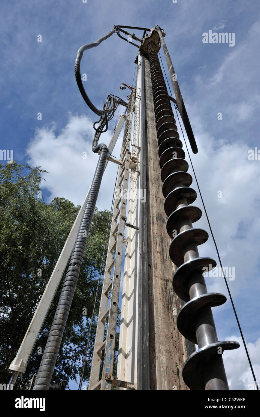 piling machine drilling foundation on building site Stock Photo - Alamy