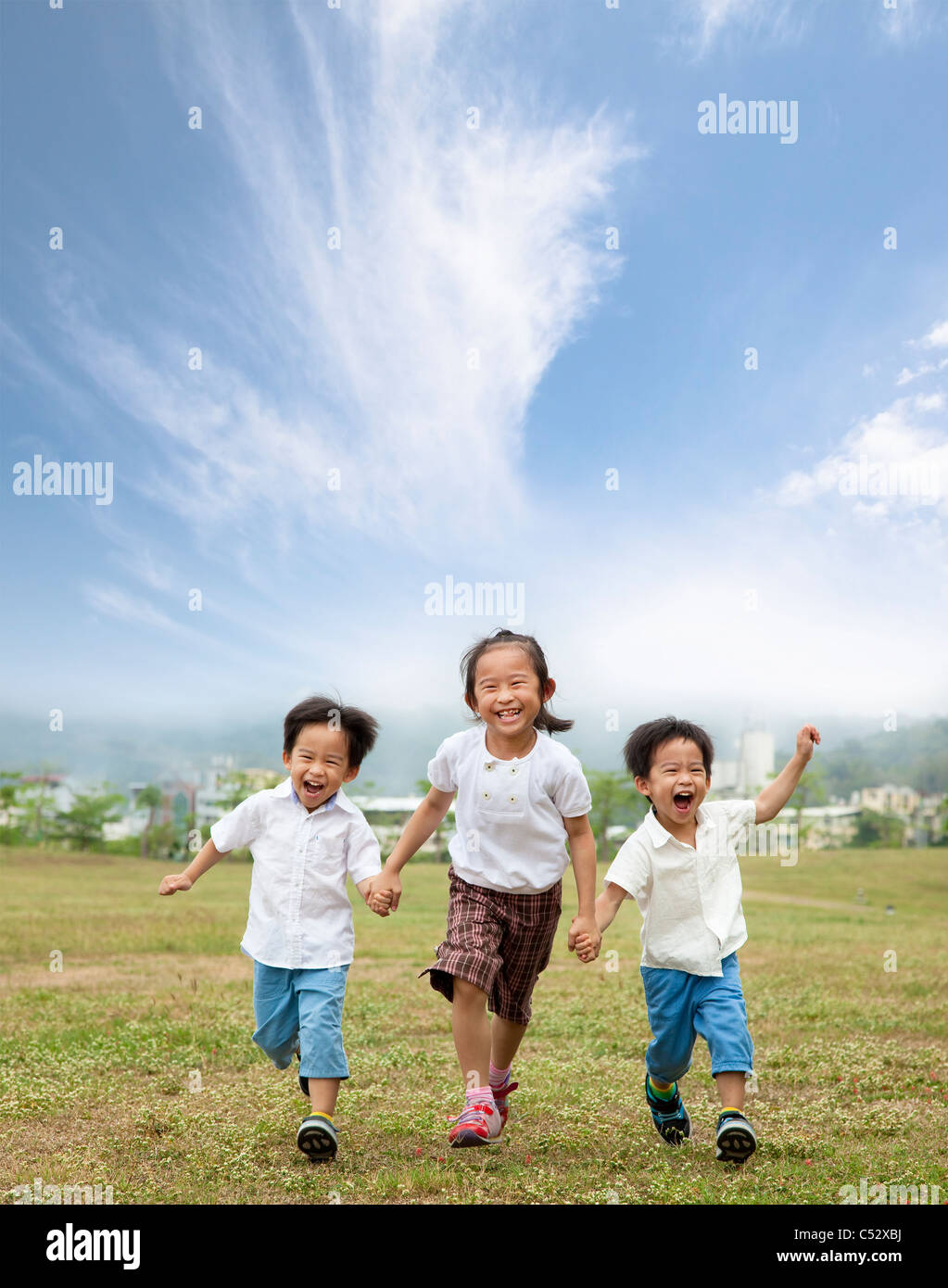 happy running asian kids Stock Photo - Alamy