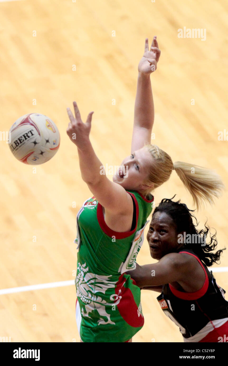 Chelsea Lewis of Wales(green) and Crystal Ann George in action during ...
