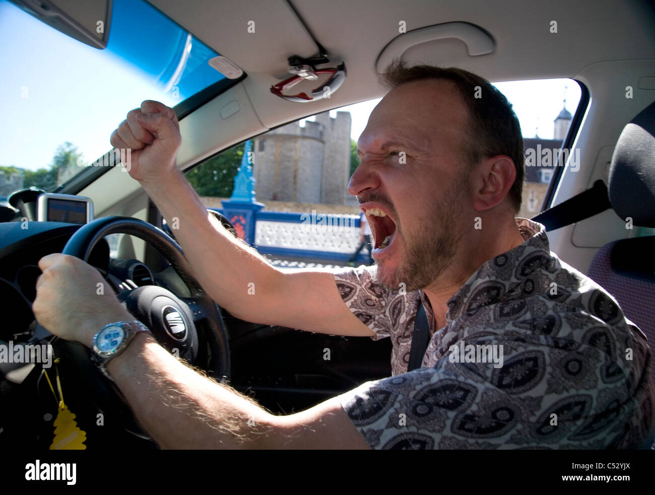 Man driving car - road rage Stock Photo - Alamy