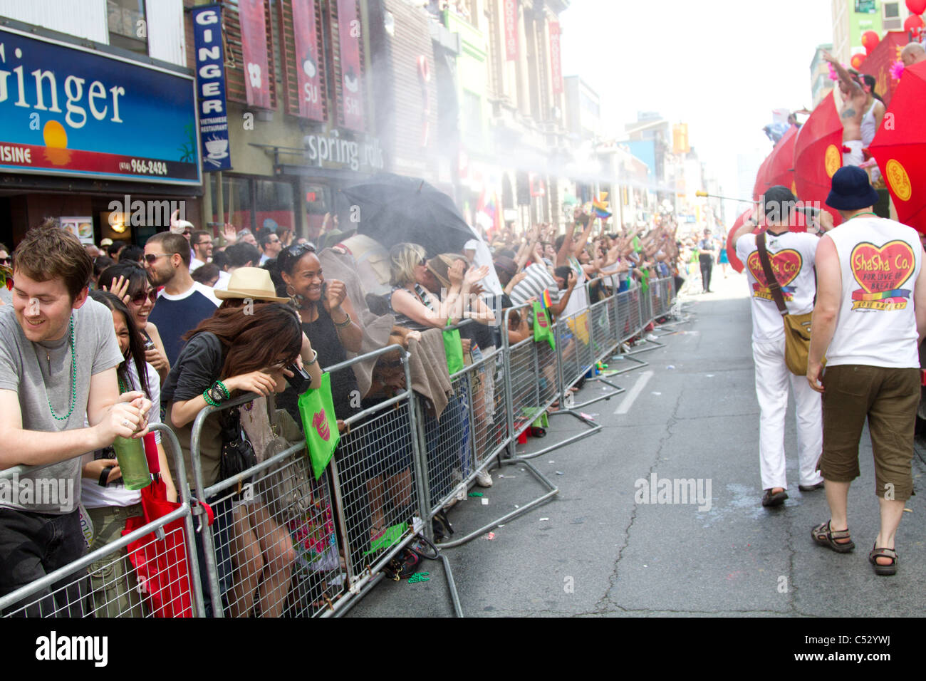 spraying water gun crowd excited happy celebrate Stock Photo - Alamy
