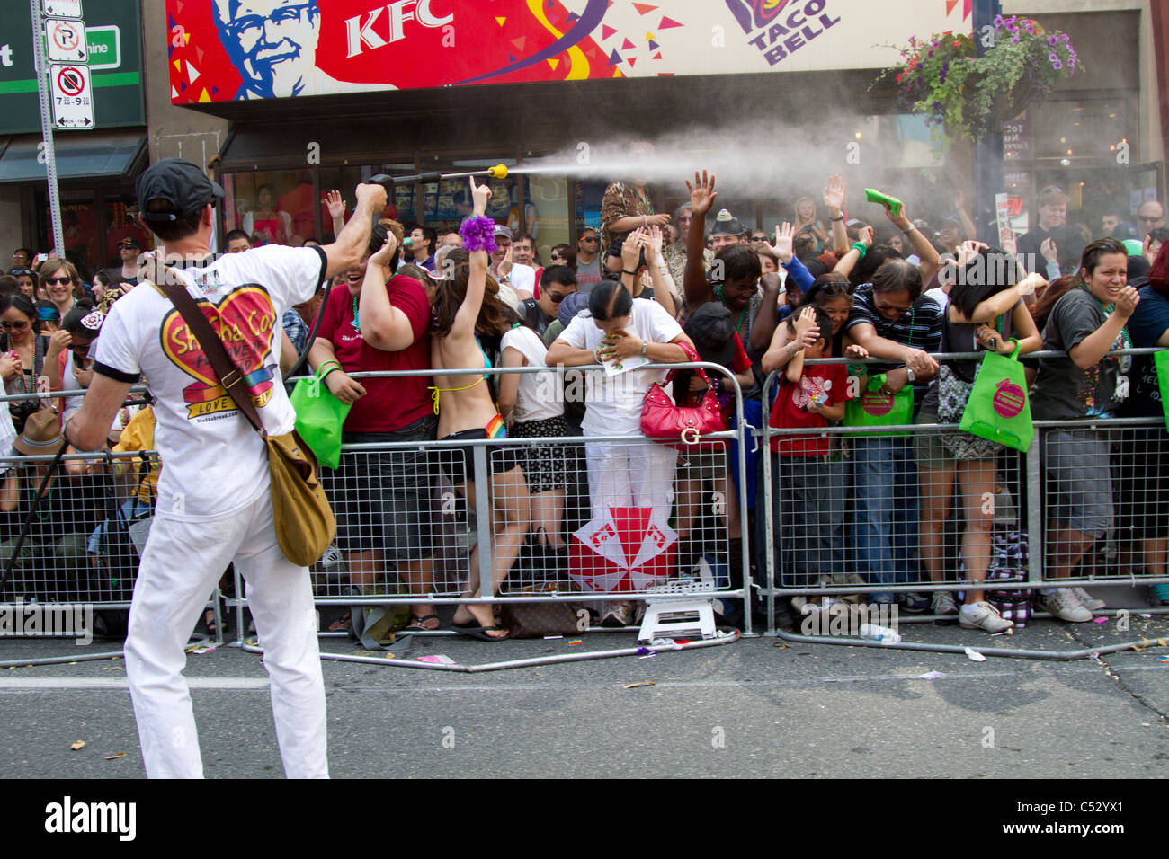 "water gun" splash splashing people pride parade Stock Photo - Alamy