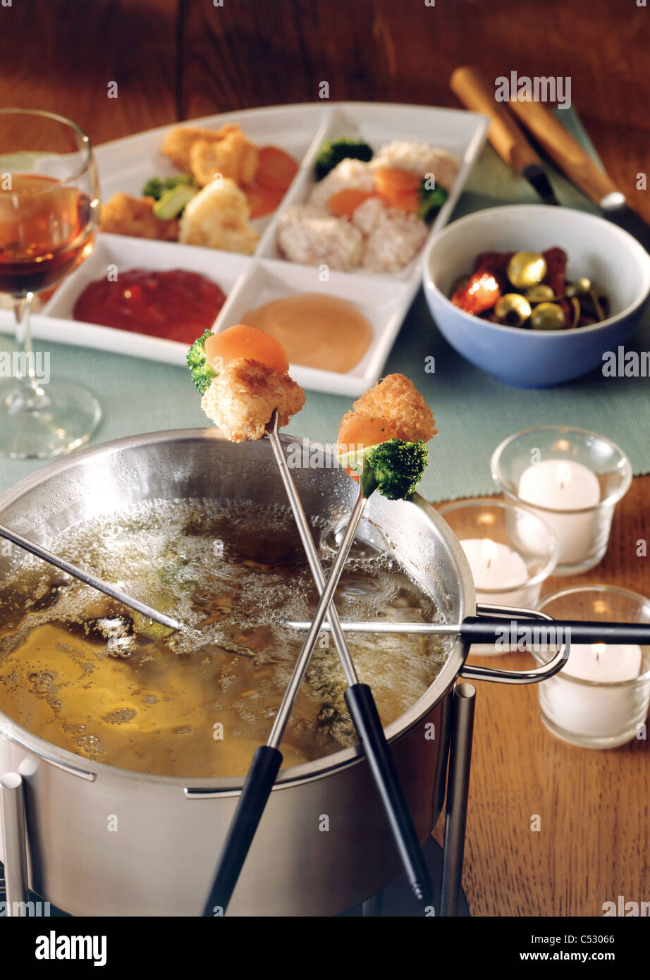 Fish - vegetable - fondue Stock Photo - Alamy