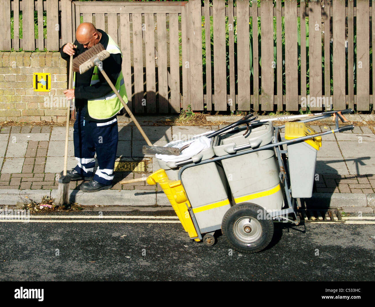 Man sweeping street hi-res stock photography and images - Alamy