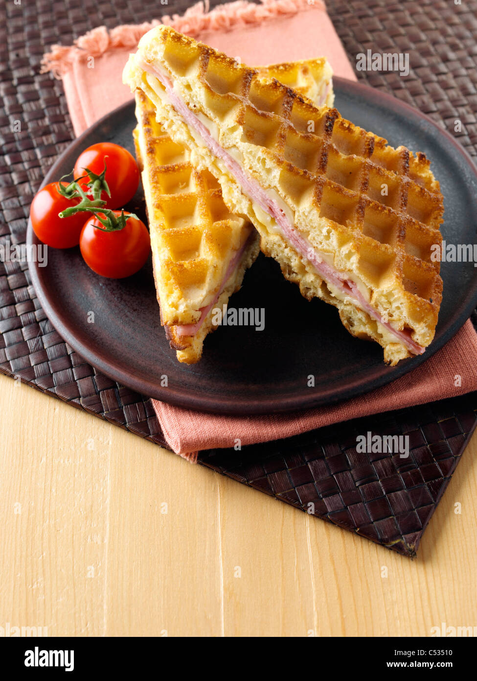 Waffle sandwich with ham and cheese American snack Stock Photo - Alamy