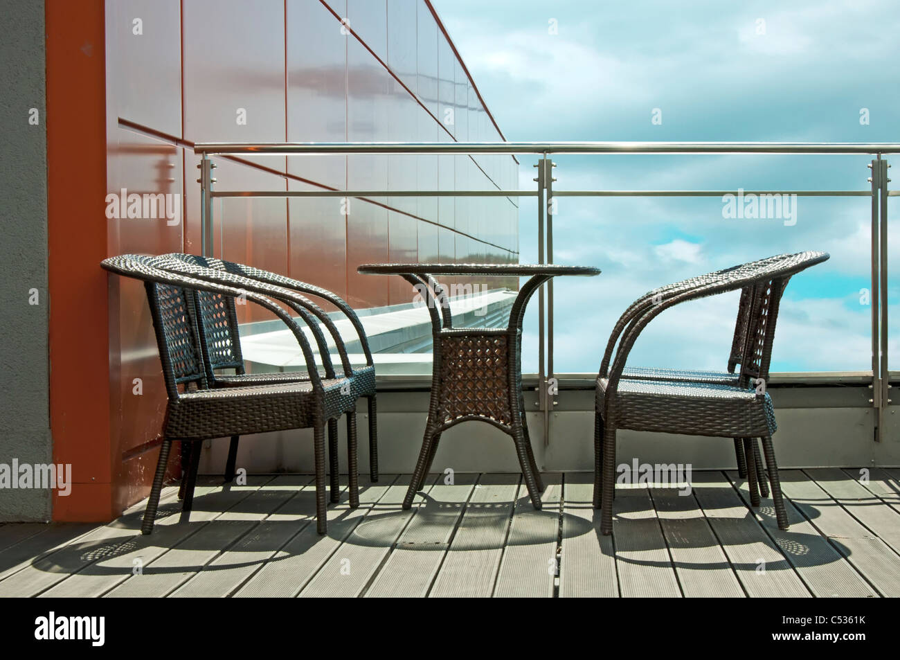 Table with two chairs on terrace Stock Photo - Alamy