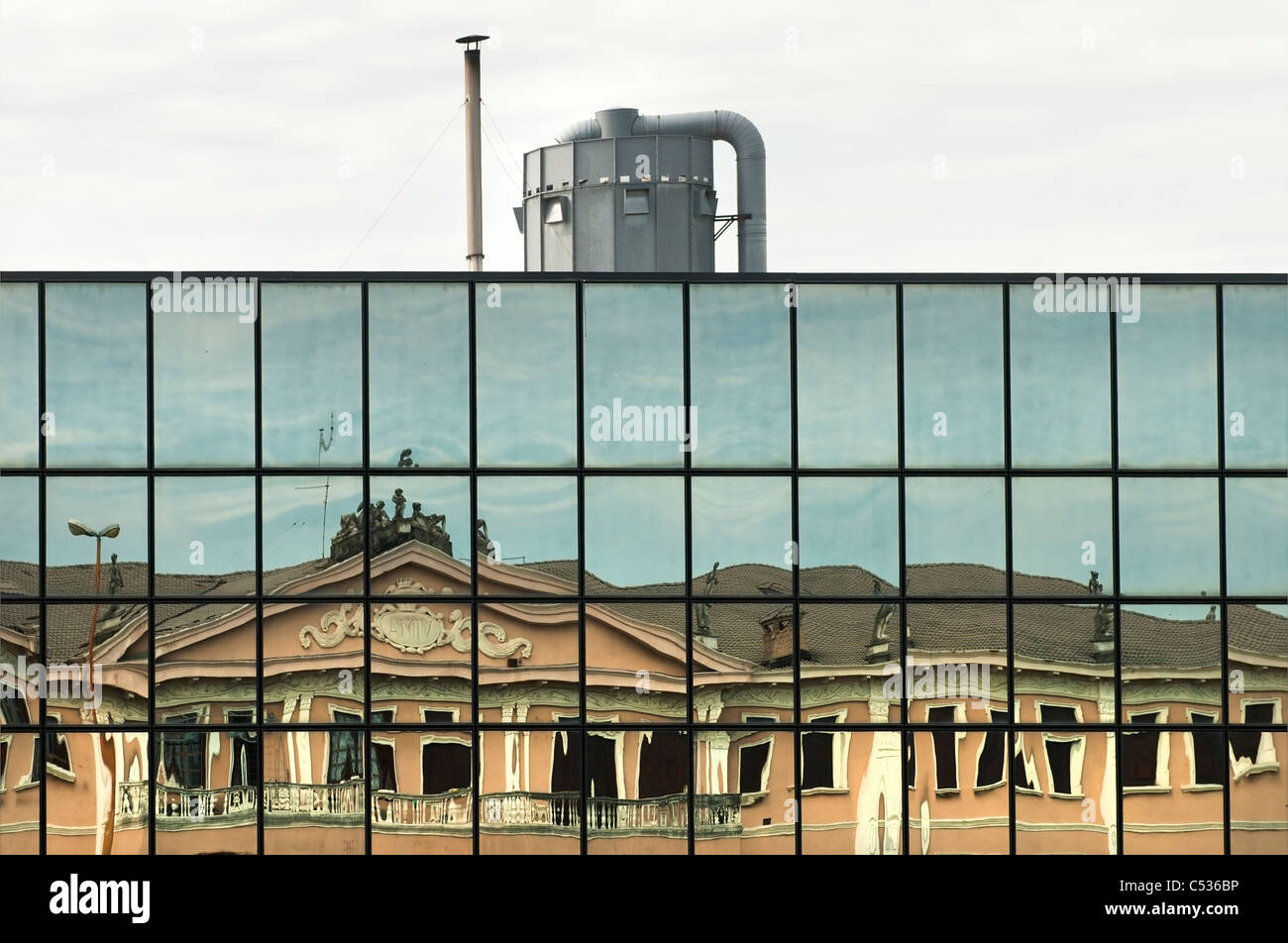 the reflection of a classic house in a modern frontage building Stock ...