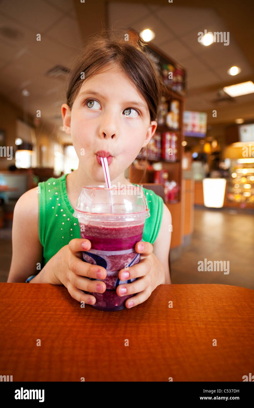 girl drinking smoothie in coffee shop Stock Photo - Alamy