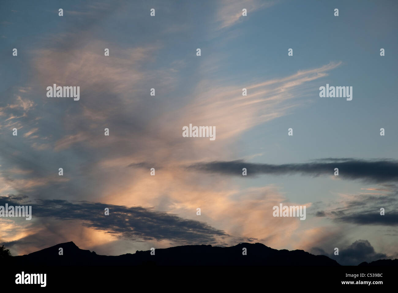 Sunset over the mountains of the Isle of Arran, Scotland Stock Photo ...