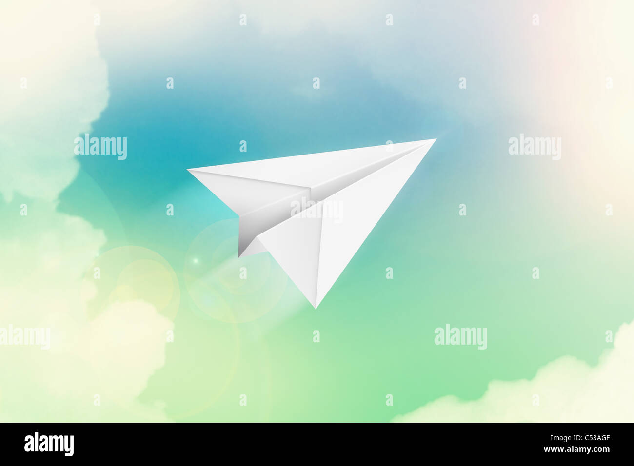 Paper plane flying through the air Stock Photo - Alamy