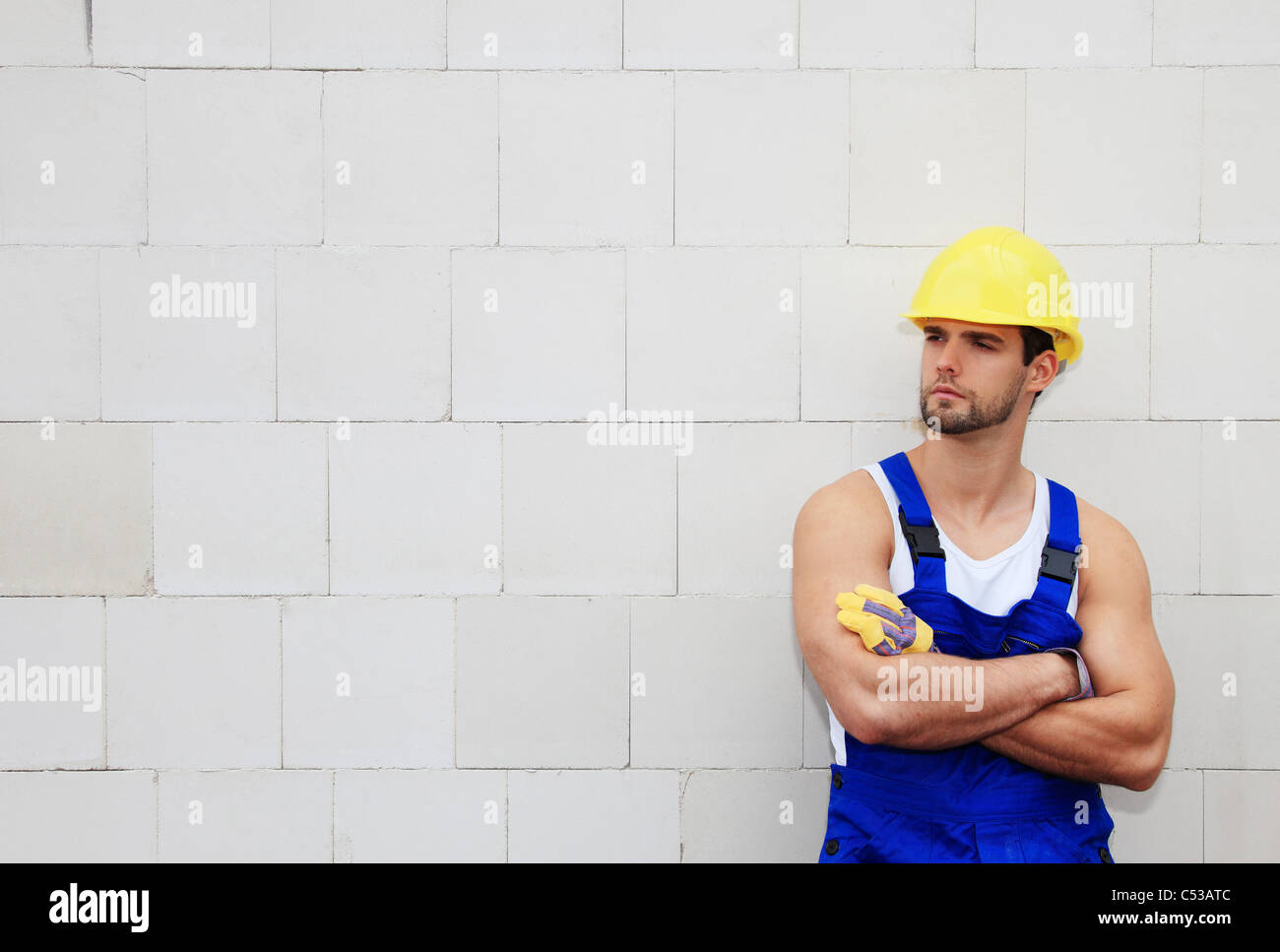 Manual worker on construction site Stock Photo - Alamy
