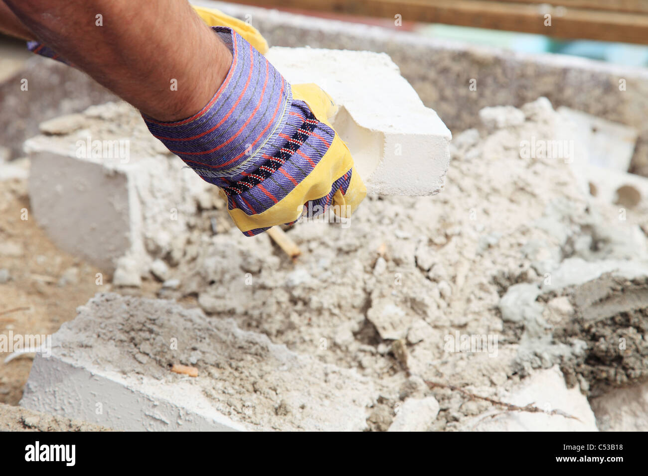 Manual worker on construction site Stock Photo - Alamy
