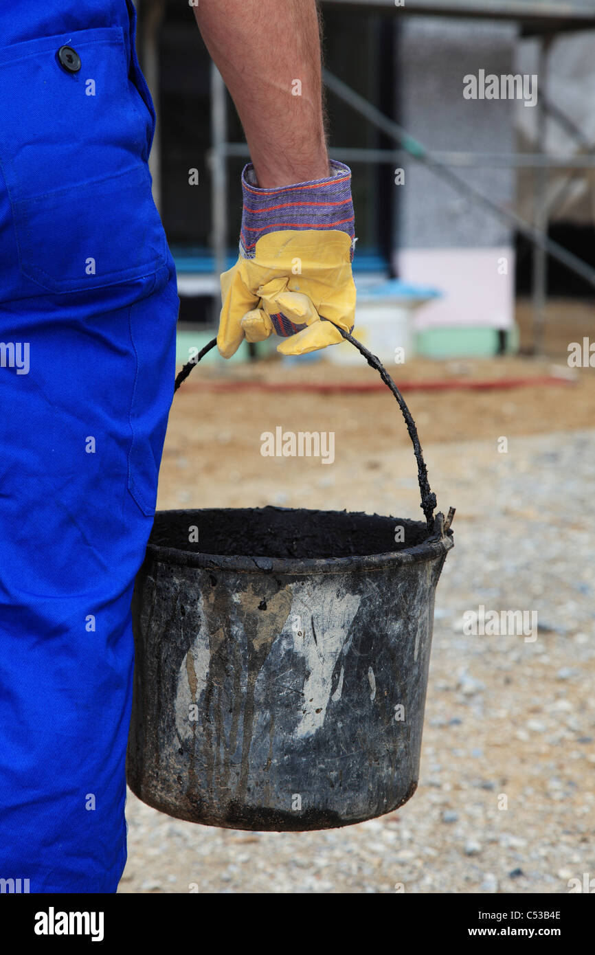 Carrying a bucket hi-res stock photography and images - Alamy