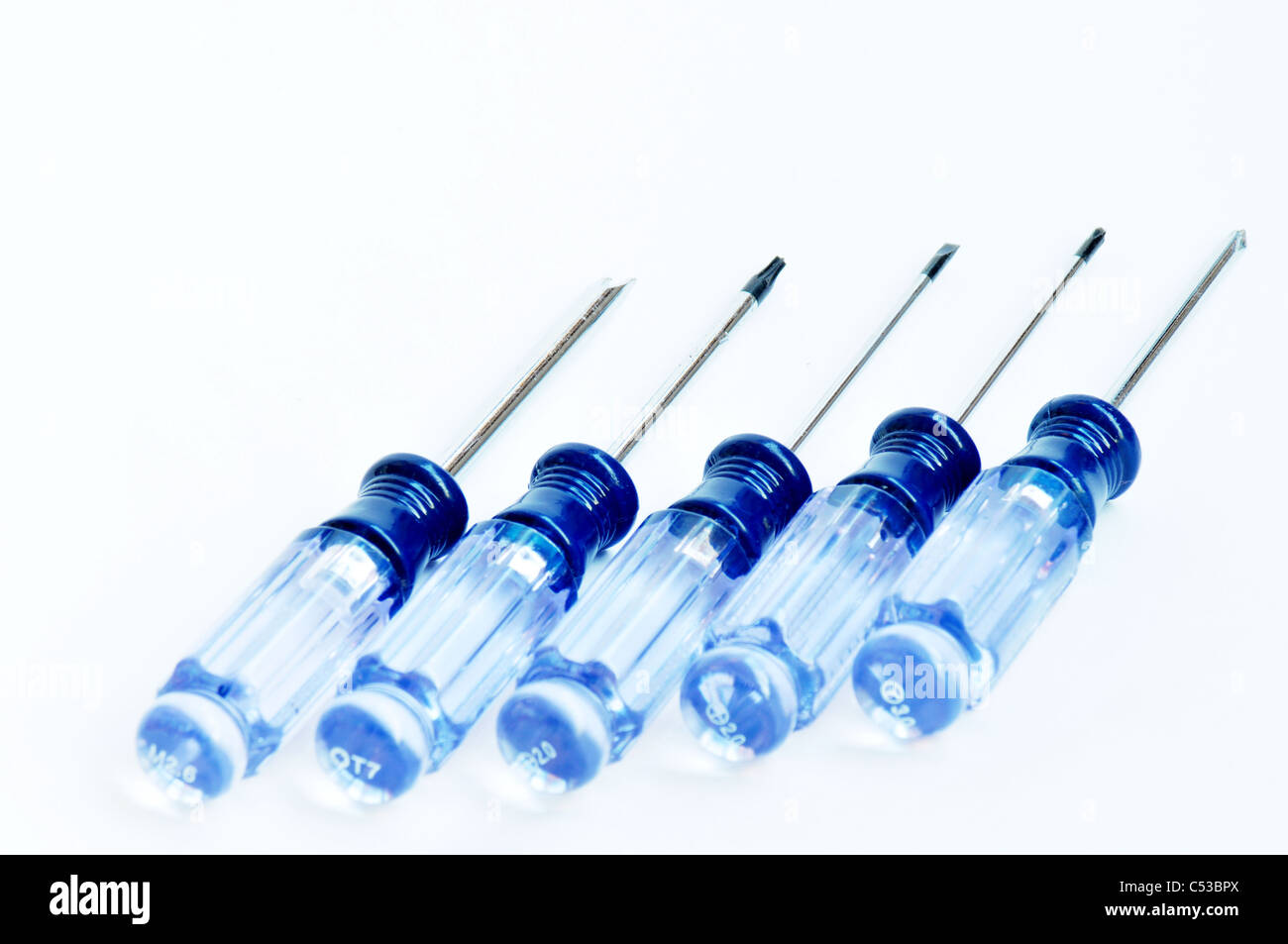 A group of special screw drivers on a white background Stock Photo - Alamy