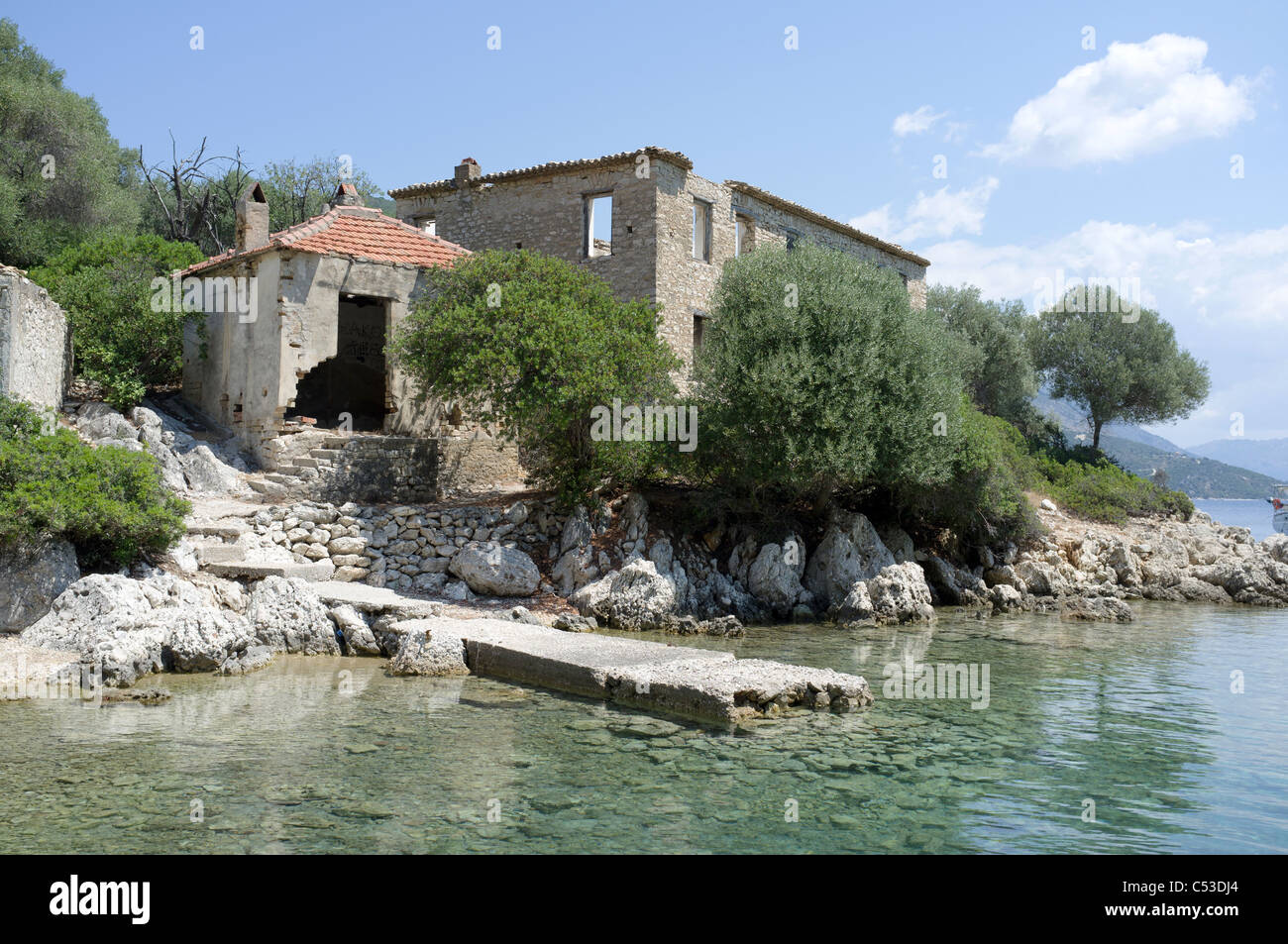 Abandoned buildings and pontoon, Port Leone, Kalamos, Ionian, Greece ...