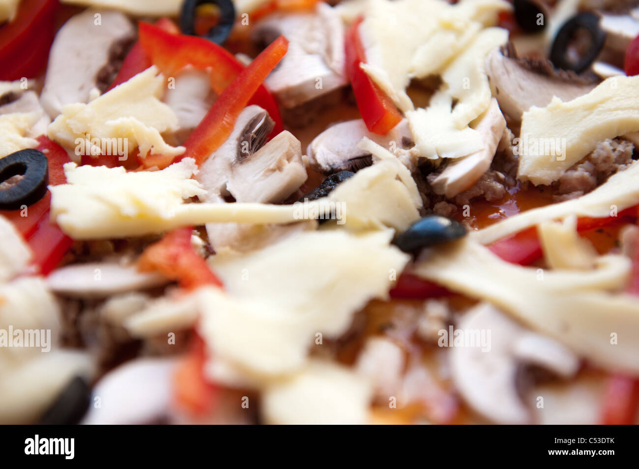 Background of unbaked pizza before cooking. Close view Stock Photo - Alamy
