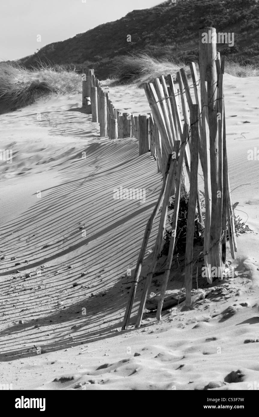 Old Fence on a Sandy Beach in Black and White Stock Photo - Alamy