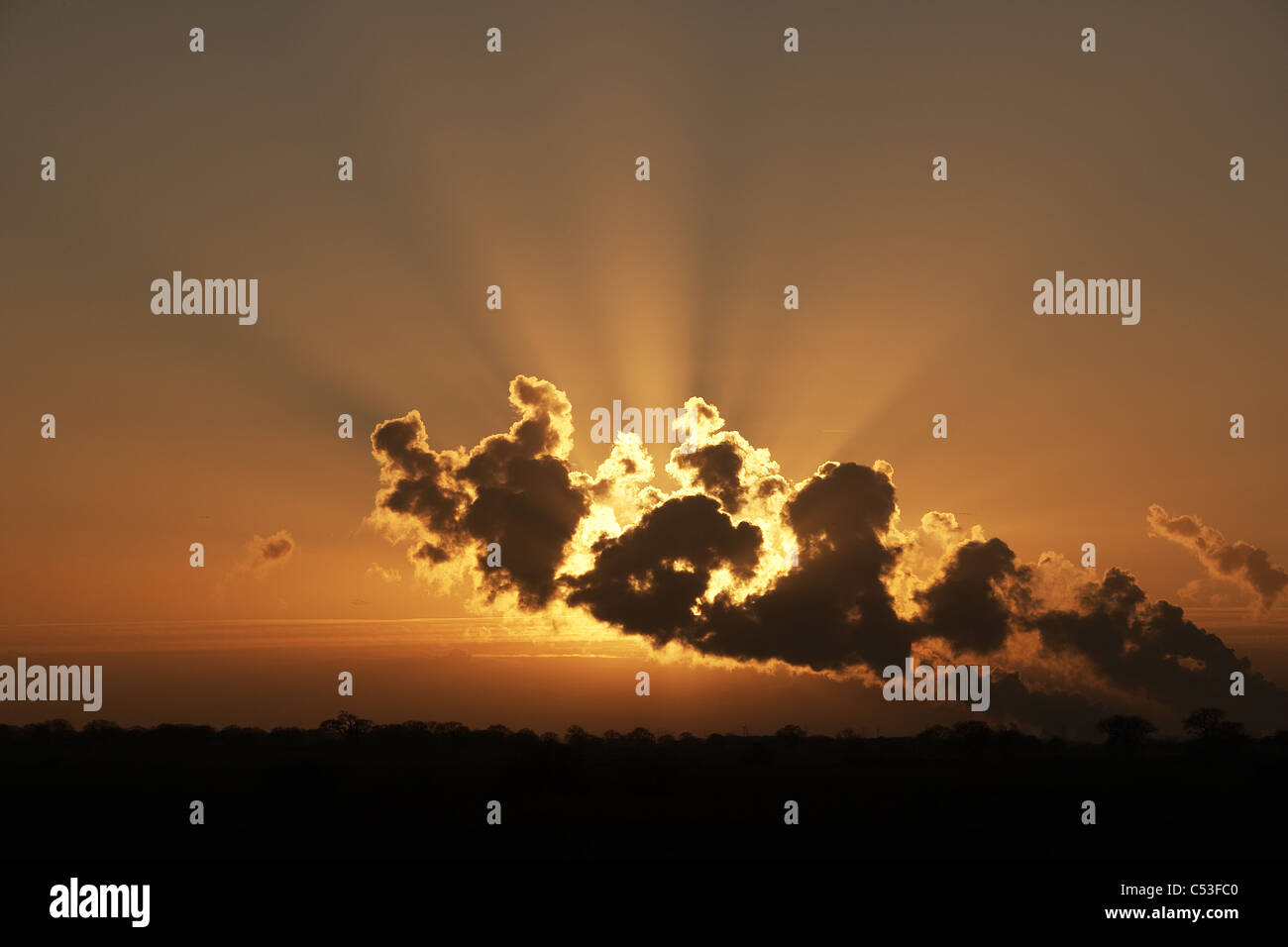 Sunburst through clouds hi-res stock photography and images - Alamy