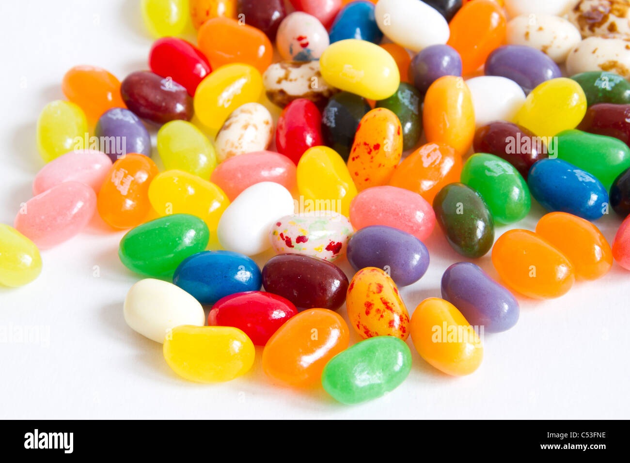 many candy colored isolated on white Stock Photo - Alamy