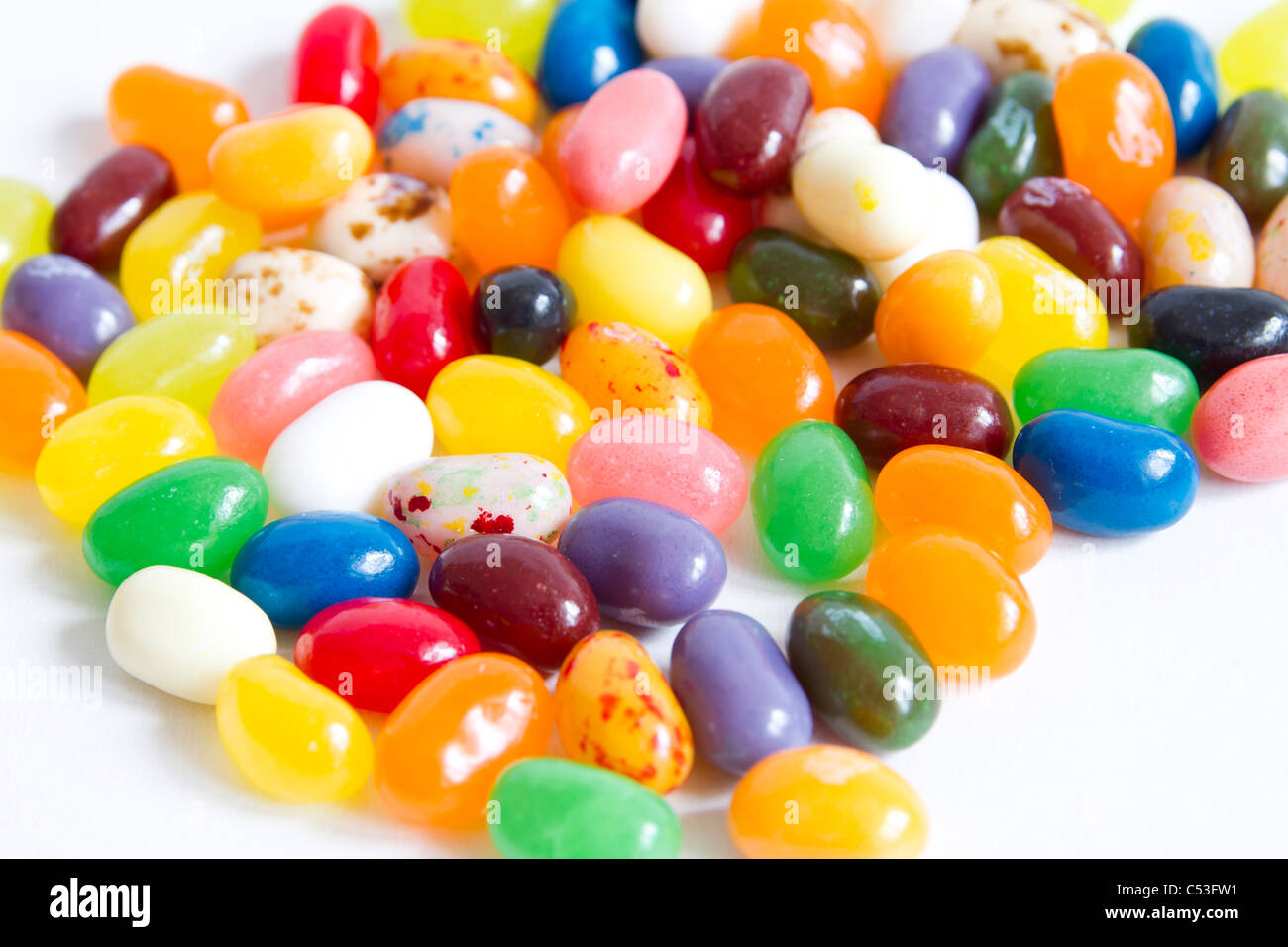 many candy colored isolated on white Stock Photo - Alamy