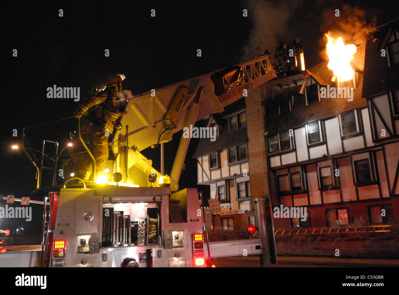 Members of the Anchorage Fire Department work during a cold winter ...