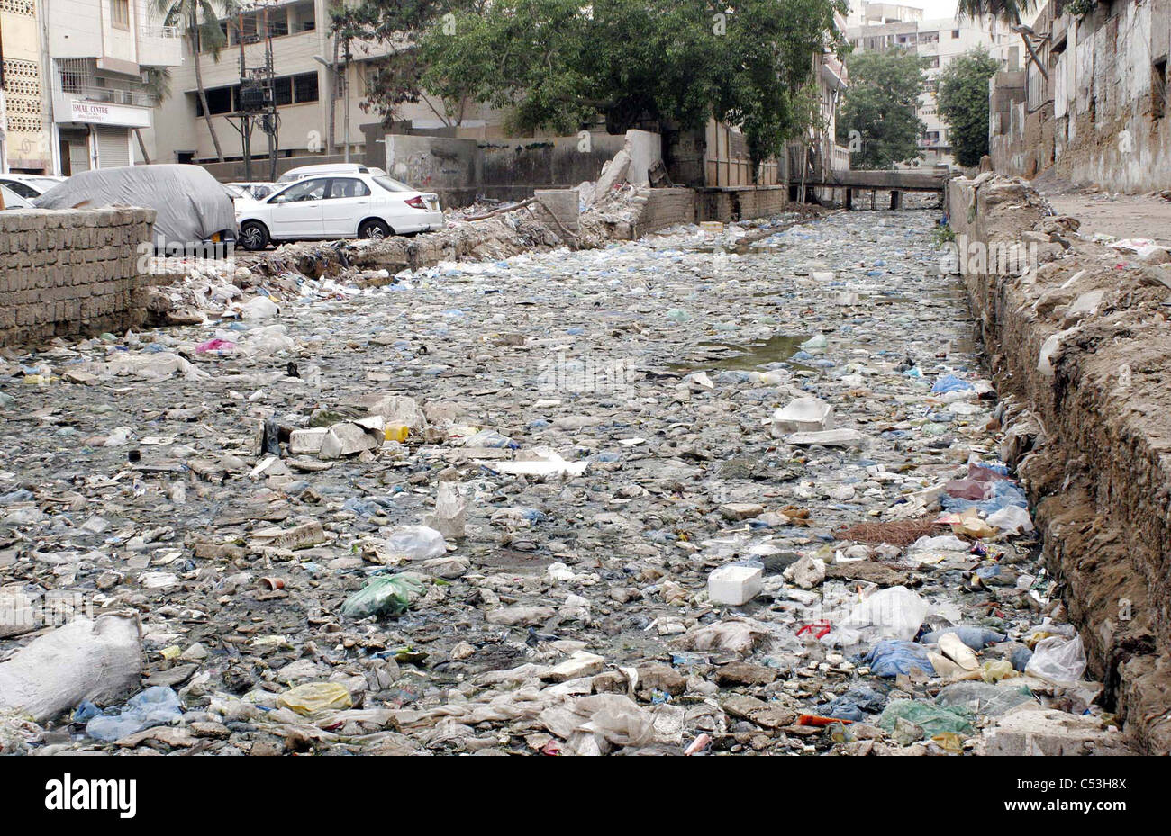View of sewerage water drain that fills with polythene bags hi-res ...