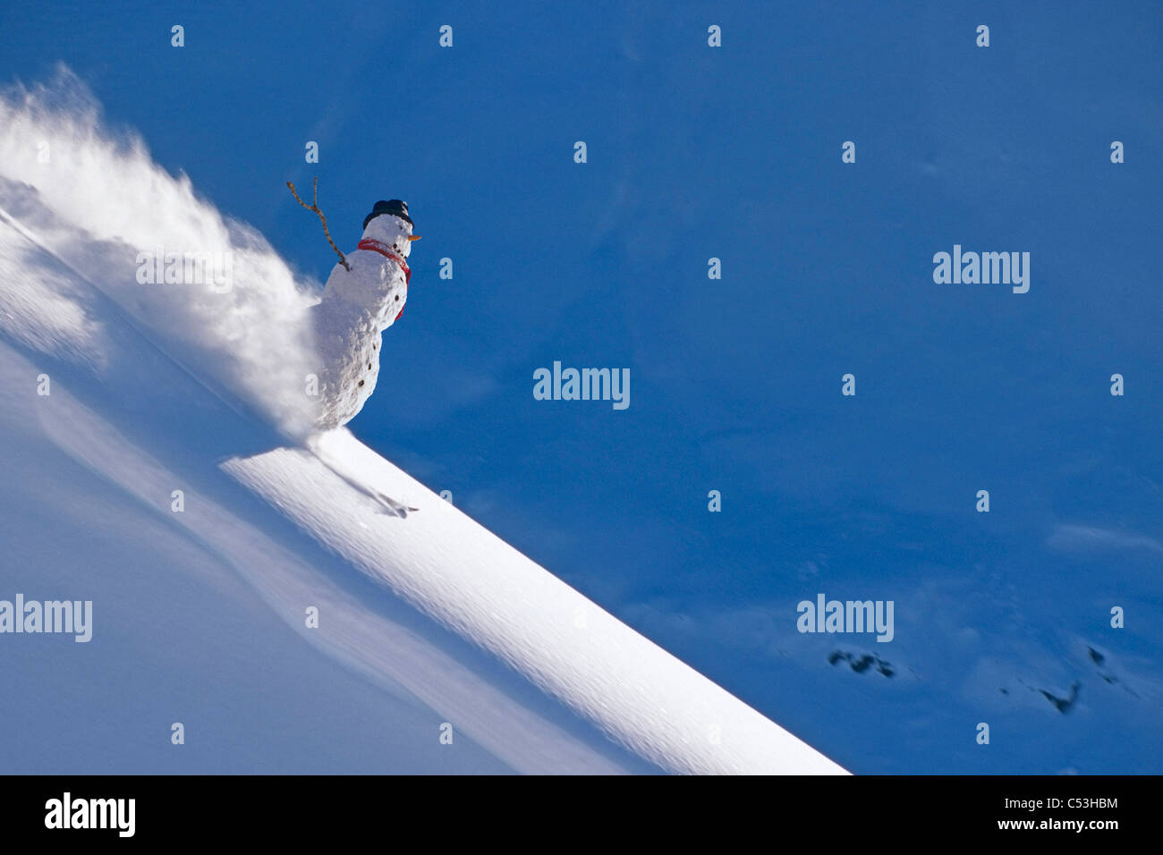 Snowman skiing down ridgeline in Talkeetna Mountains, Southcentral ...