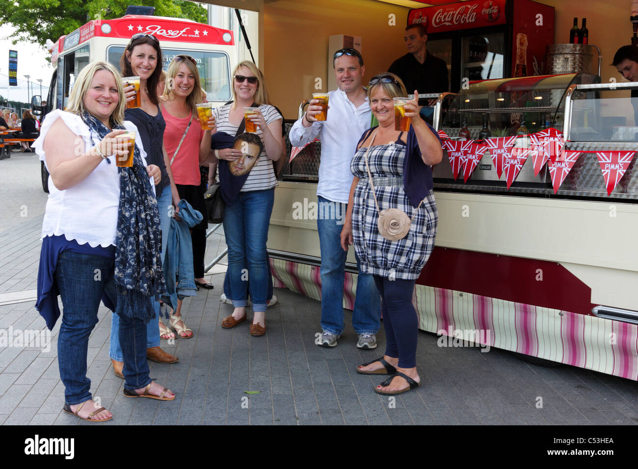TAKE THAT fans pose for the camera outside a refreshment bar at Wembley ...
