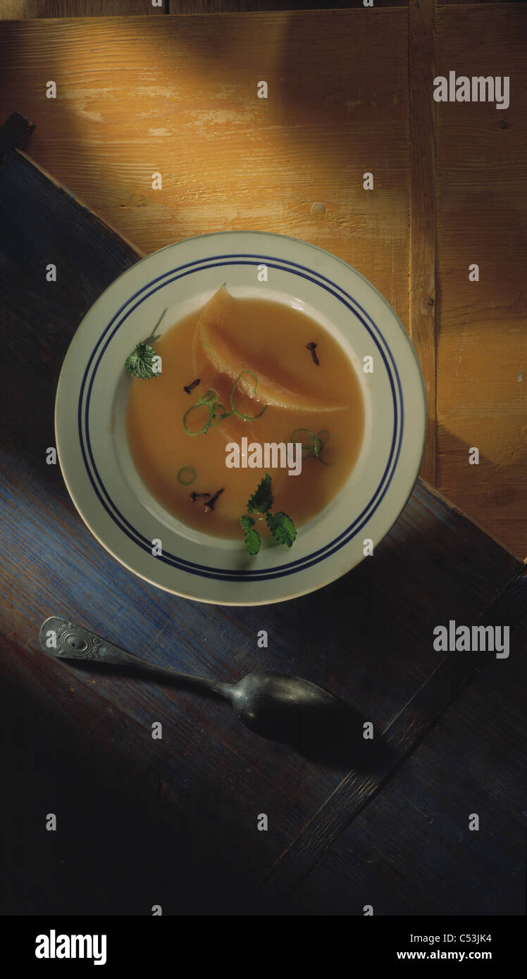 Cold melon soup with ginger and carnations Stock Photo - Alamy
