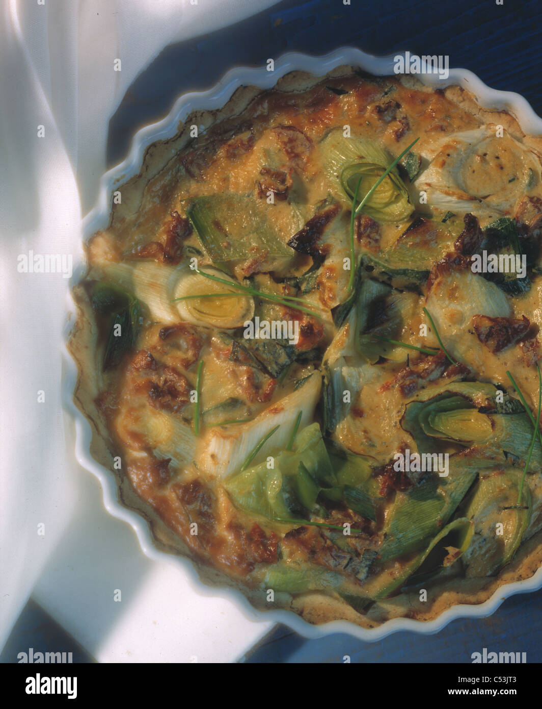 Curd quiche with leek and lemon Stock Photo - Alamy