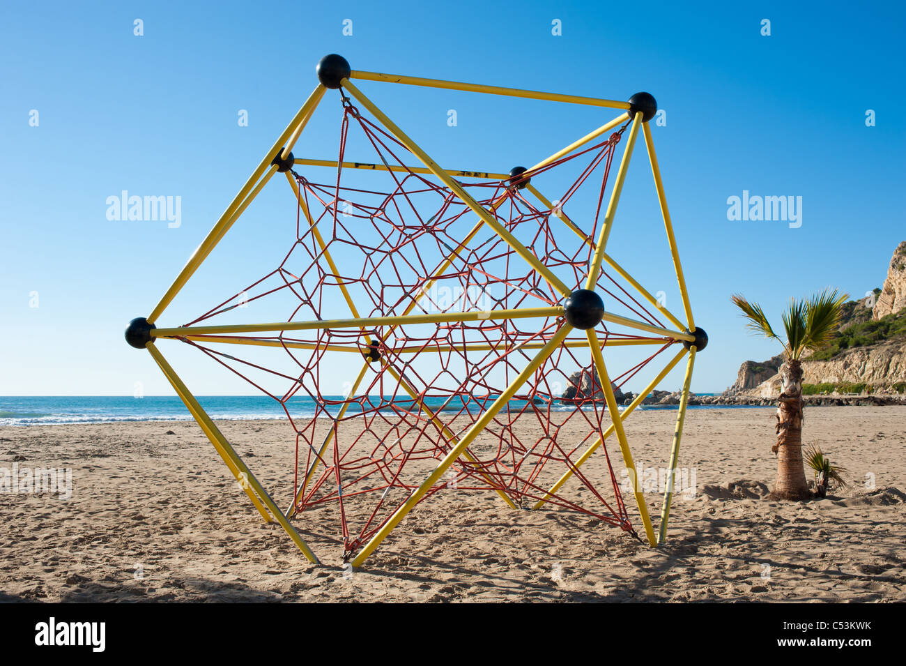 Jungle gym rope structure on a beach playground Stock Photo - Alamy