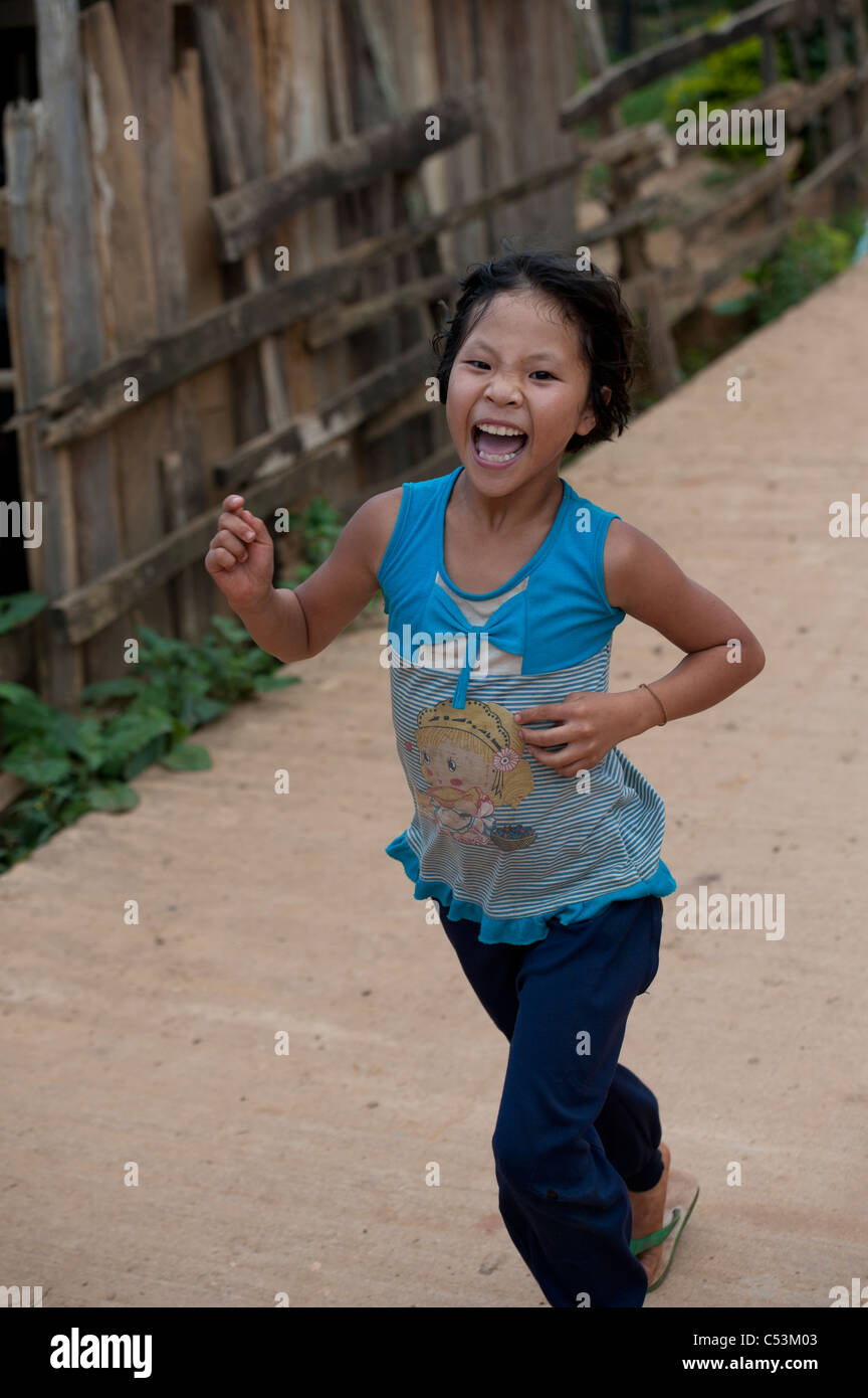 Girl running, Thailand Stock Photo - Alamy