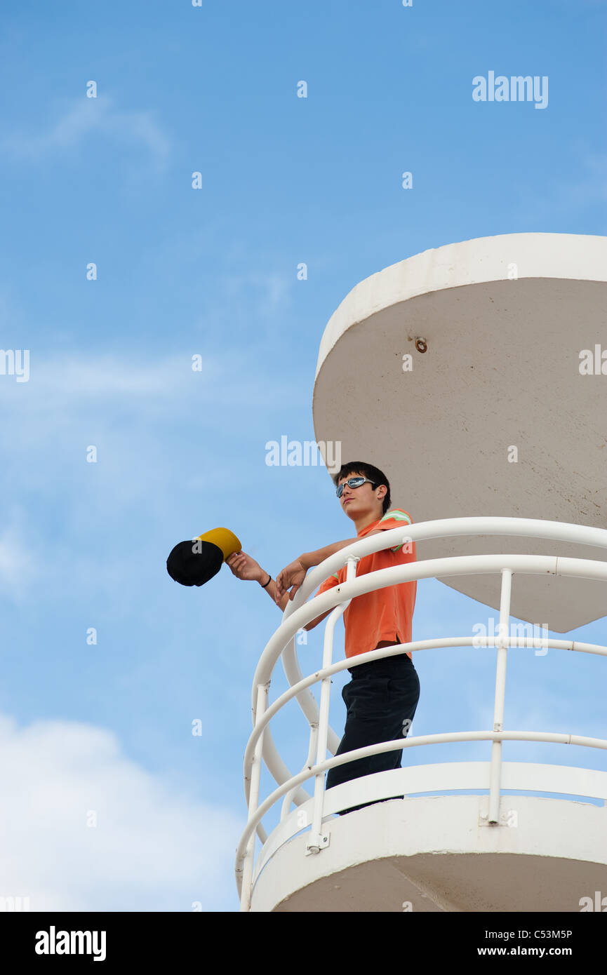 Lifeguard on duty on top of a watch-tower Stock Photo - Alamy